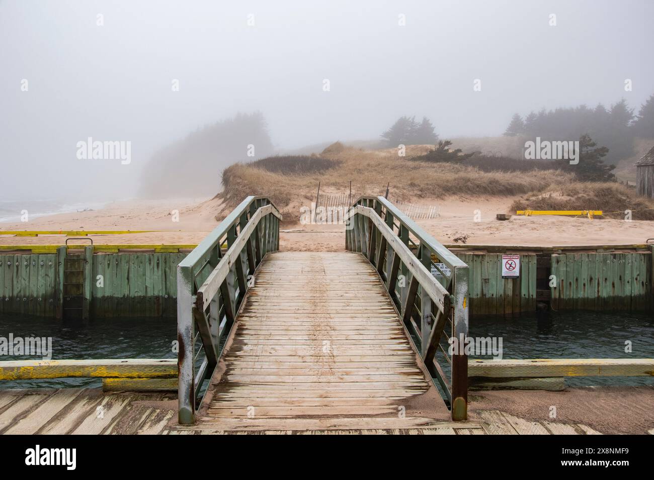 Wooden pedestrian bridge at Basin Head Provincial Park in Kingsboro ...