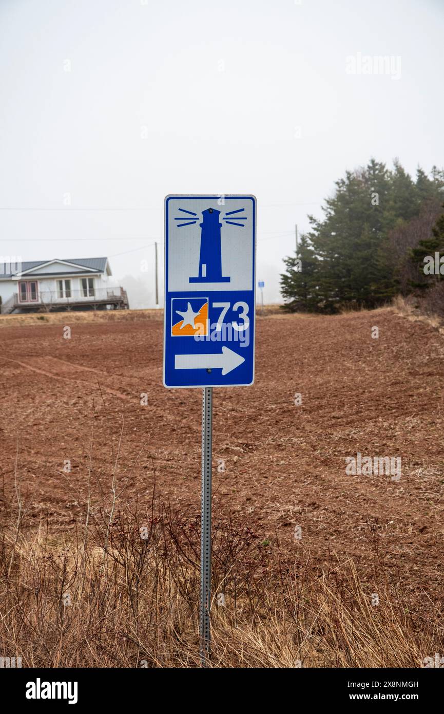 Highway sign pointing to East Point Lighthouse in Prince Edward Island ...