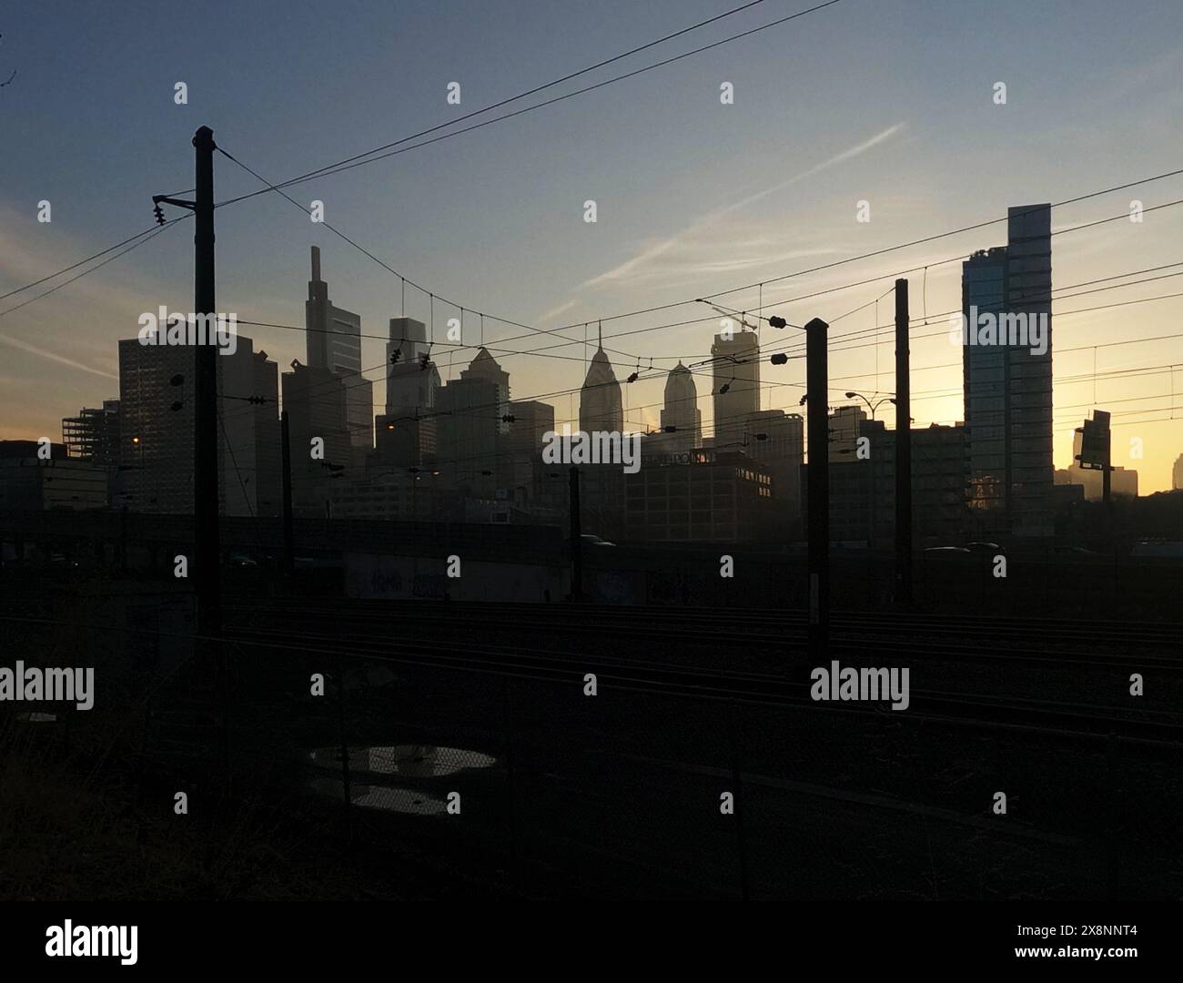 Amtrak overhead catenary lines frame the Philadelphia skyline at ...
