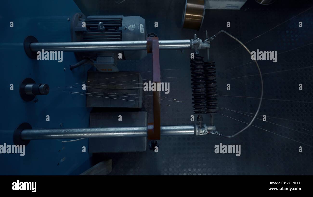 Coil winder machine with copper wire. Creative. Copper round rollers ...