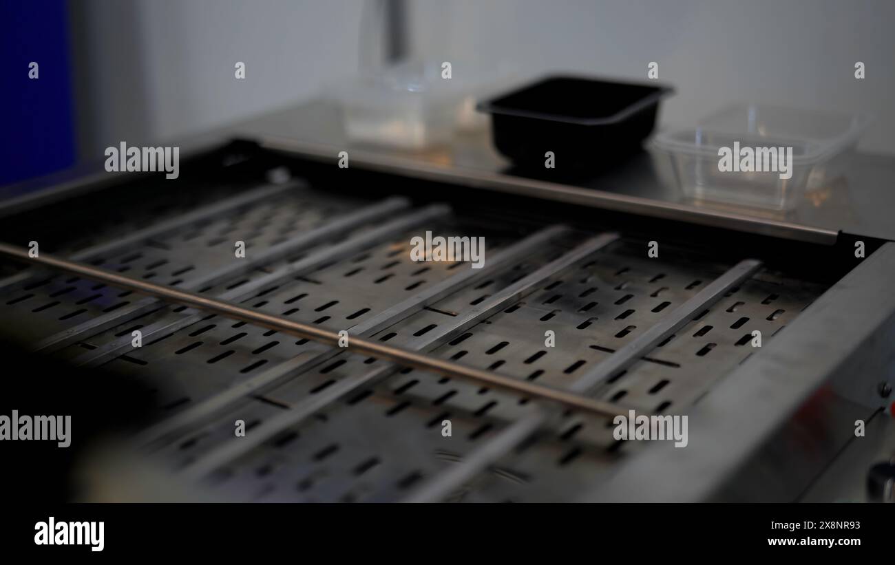 Close up of automated conveyor belt at a factory. Media. Empty conveyor ...