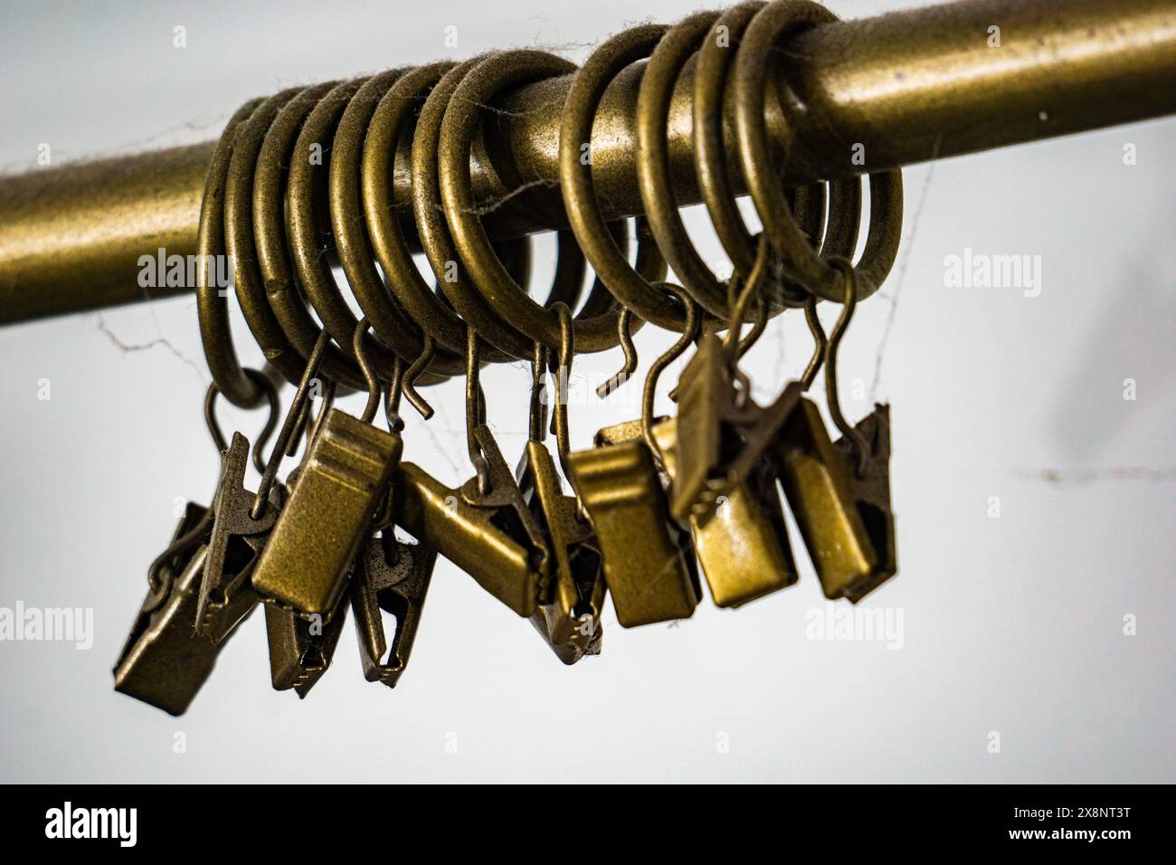 A cluster of Curtain handles covered with cobwebs on a sturdy metal ...