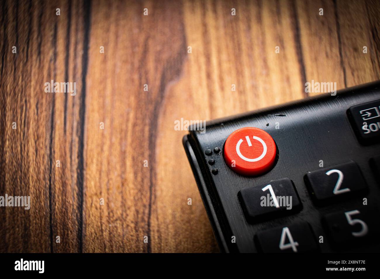 red shut off button on a remote control powering down shutting of ...