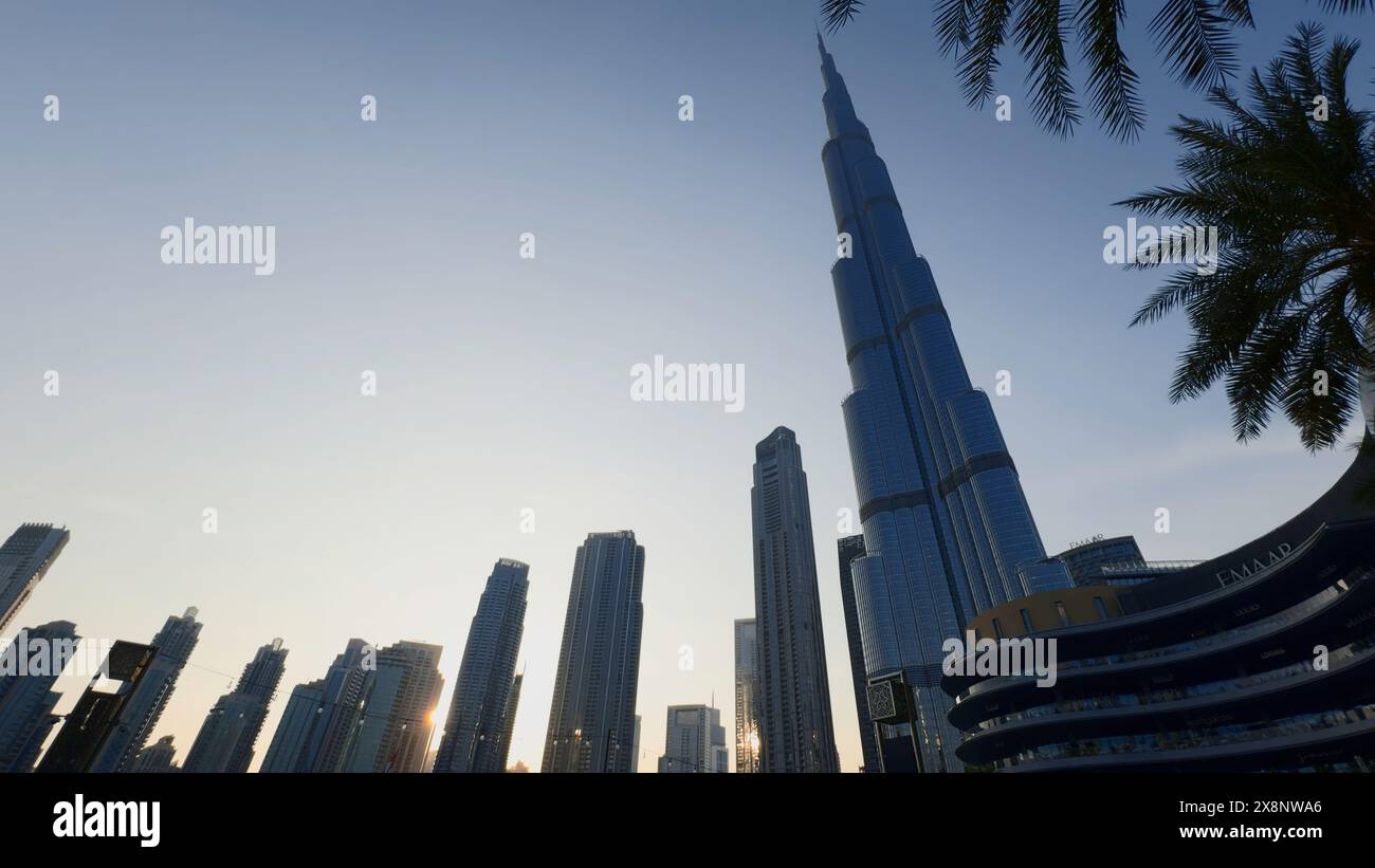 Low angle view of Burj Khalifa with blue sky behind. Action. Modern ...