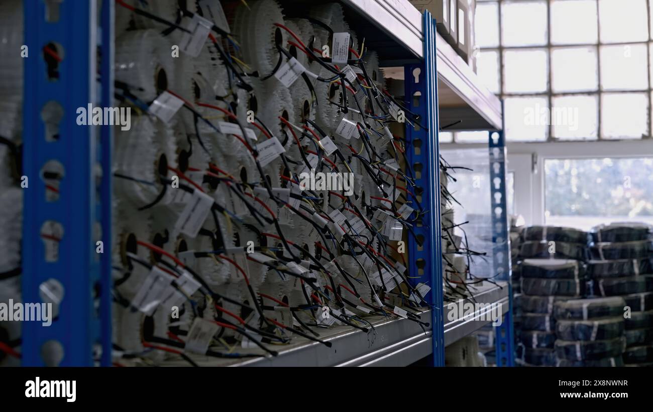 Stock of rolls on storage shelves. Creative. Insulation material in ...