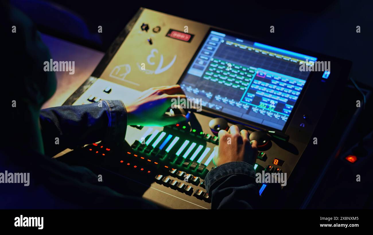 The DJ at the disco is working behind the remote control. Media. Close ...