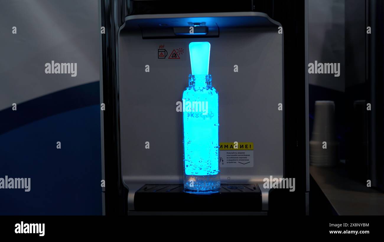 USA - New York, January 7, 2024: Modern water dispenser pouring fresh ...