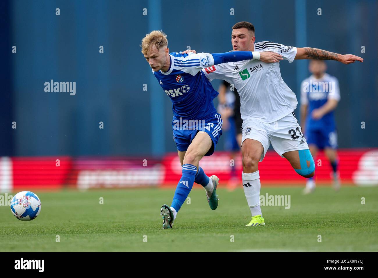 Zagreb. 26th May, 2024. Maxime Bernauer (L) of Dinamo Zagreb fights for ...