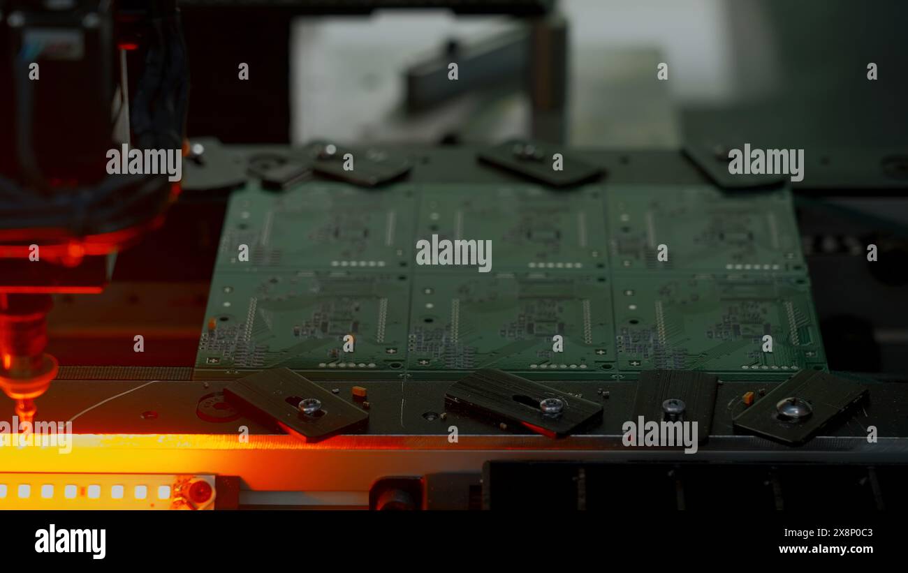 Coating machine for printed circuit board at work. Creative. Close up ...