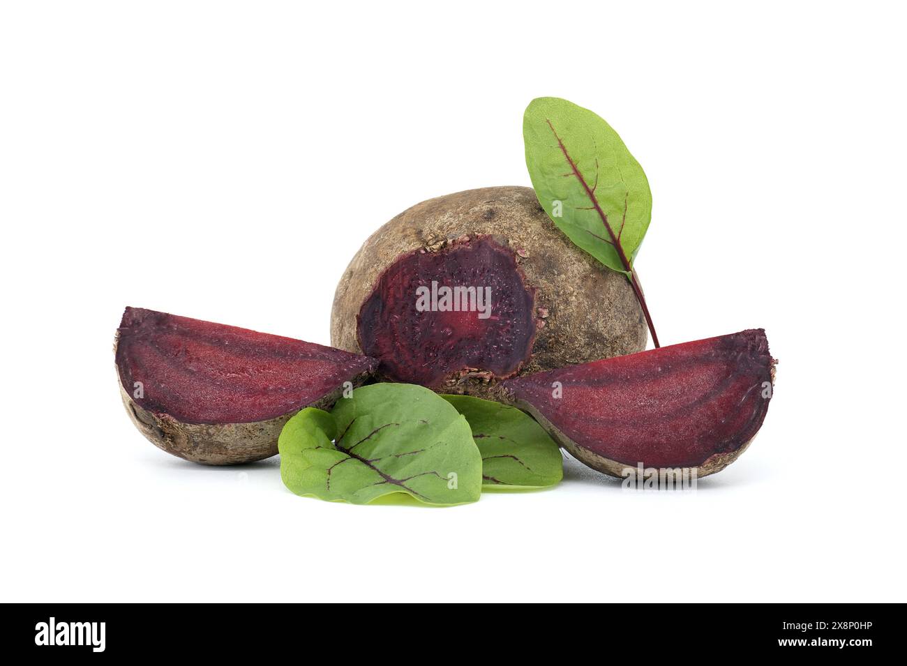 Slices of beetroot showing their purple interior arranged next to whole ...