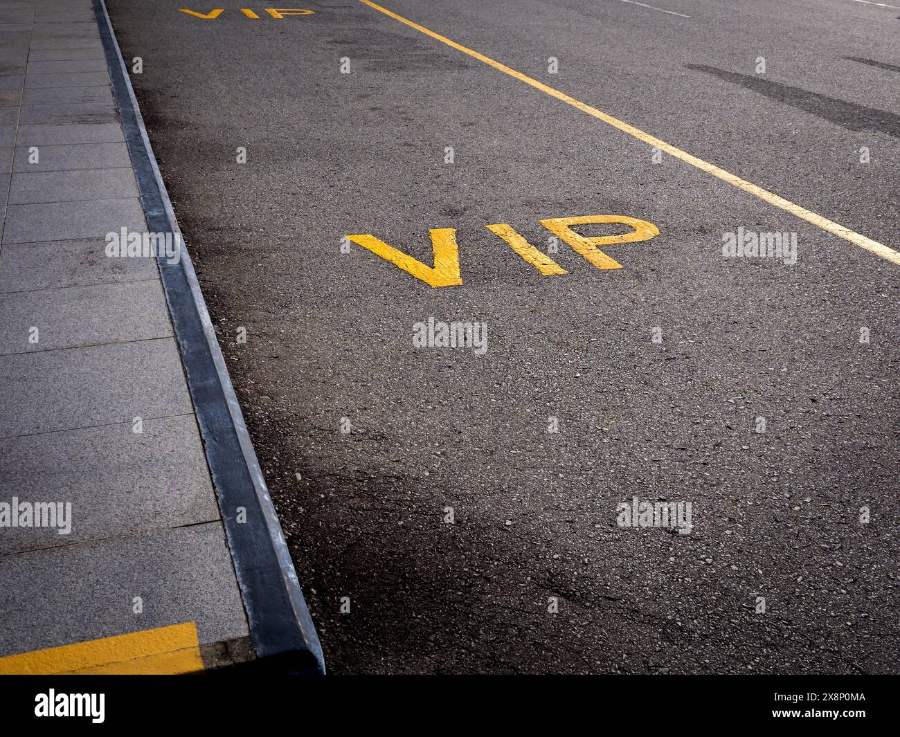 VIP parking road lane service concept, text on the empty black asphalt ...
