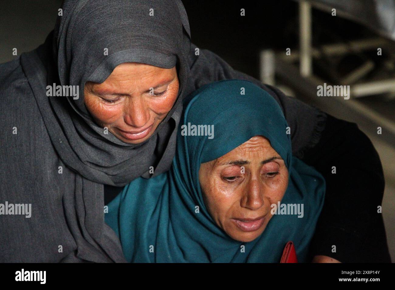 Rafah. 26th May, 2024. People mourn their relatives at a hospital in ...
