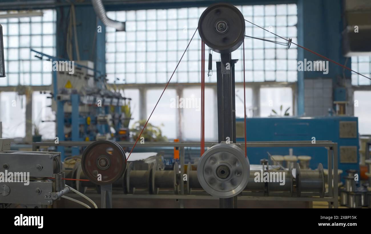 Industrial machine with rotating coils and wire. Creative. Industrial ...