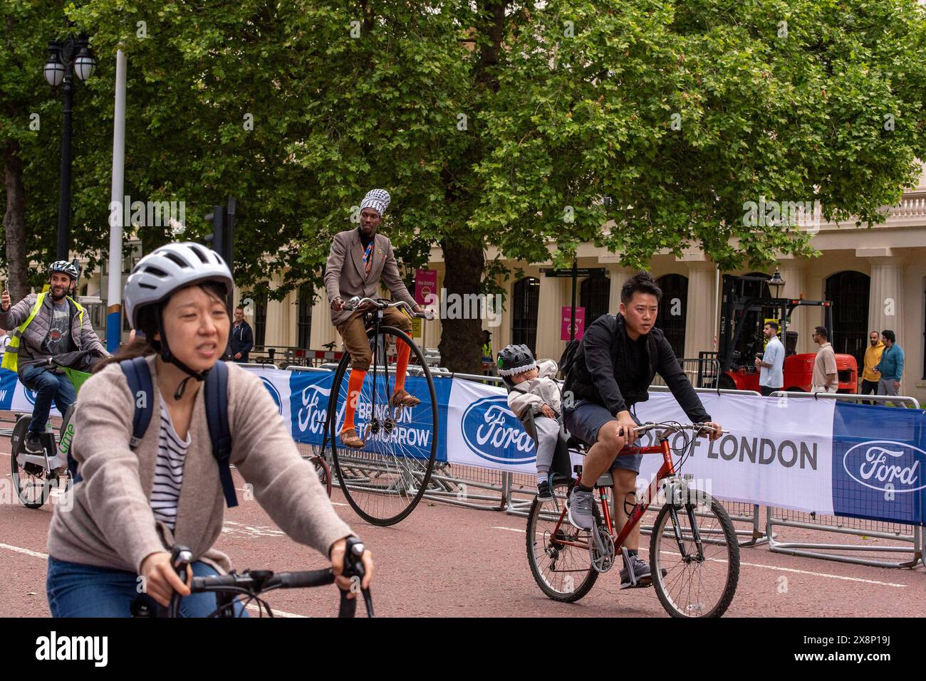 London, UK. 26th May, 2024. Cyclists ride through The Mall in London ...