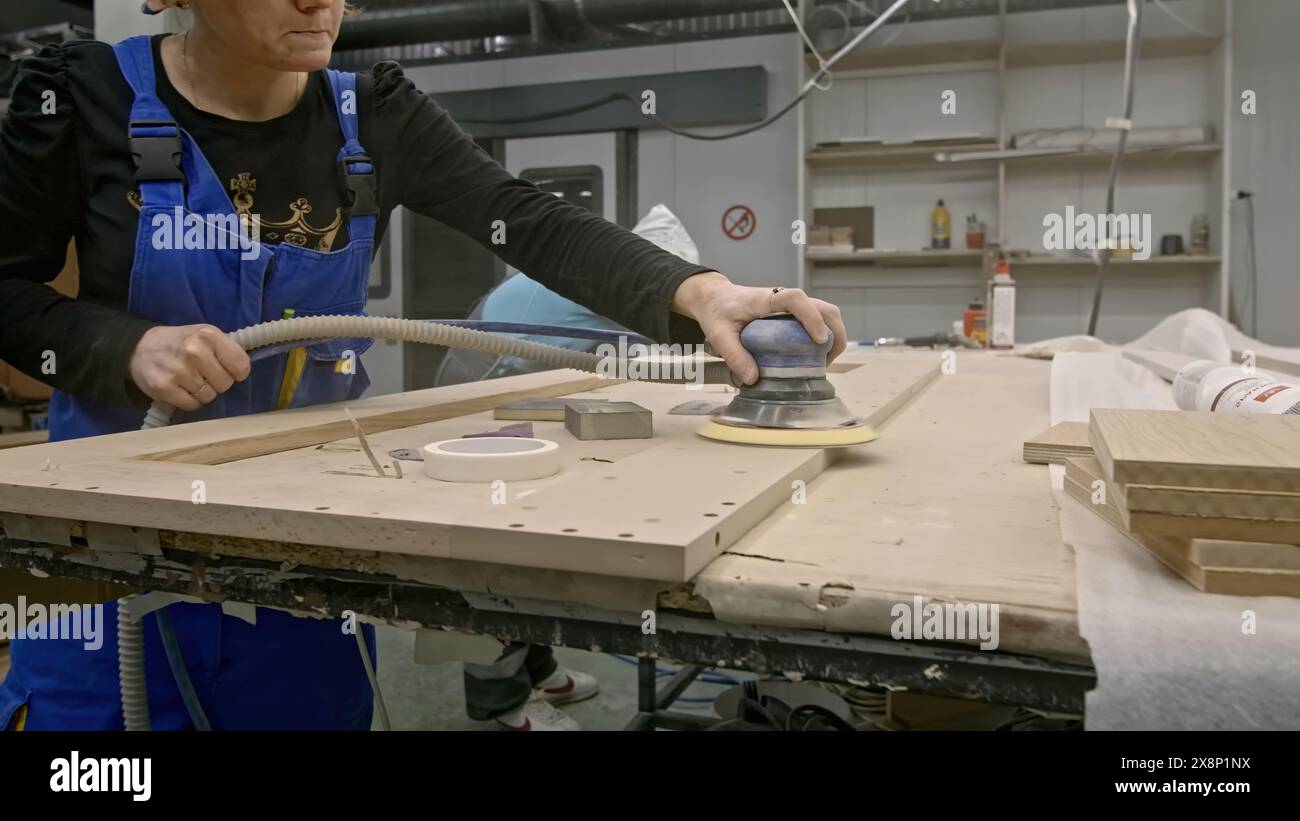 Craftsman hands polishing board with machine. Creative. Man carpenter ...