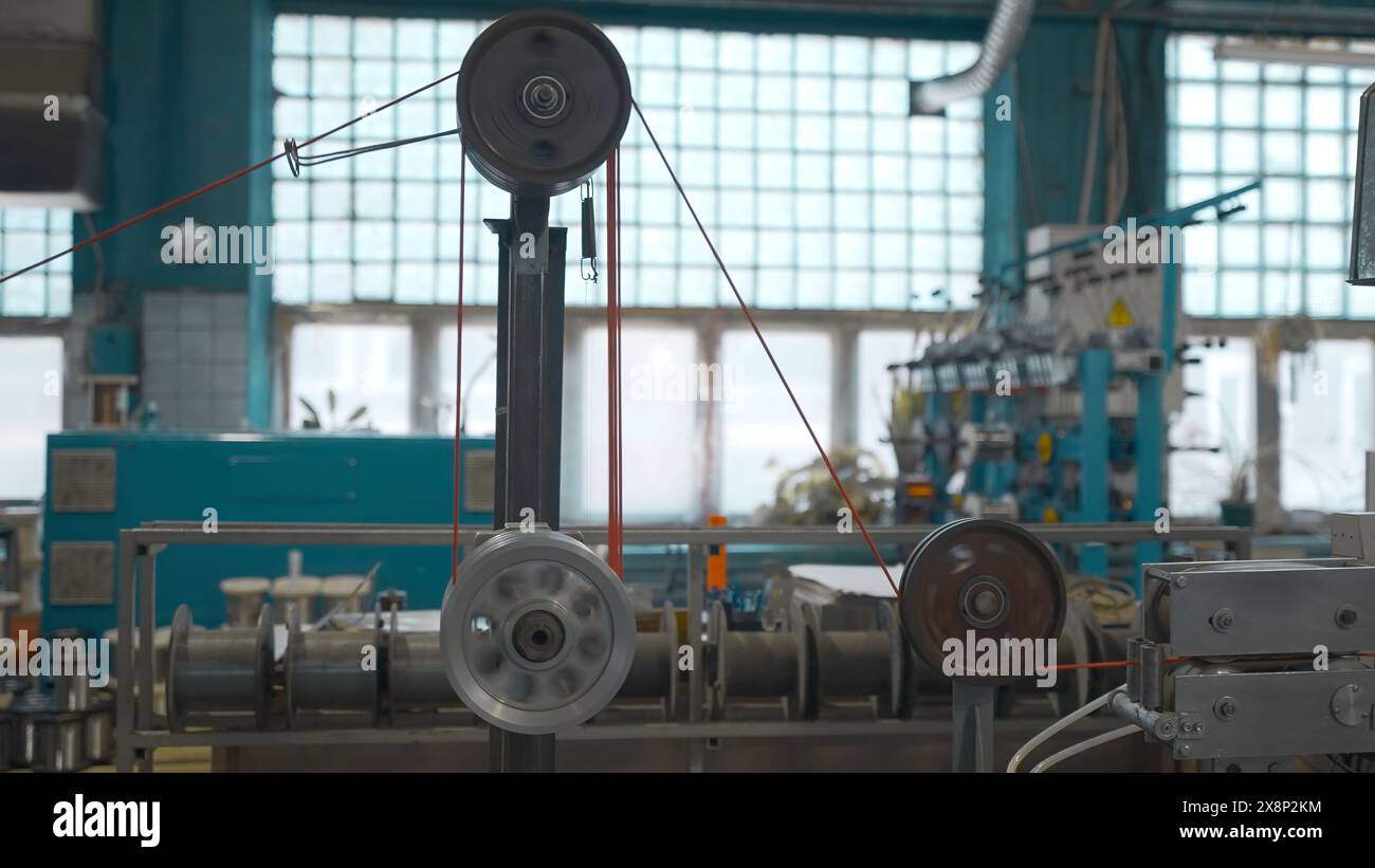 Industrial machine with rotating coils and wire. Creative. Industrial ...