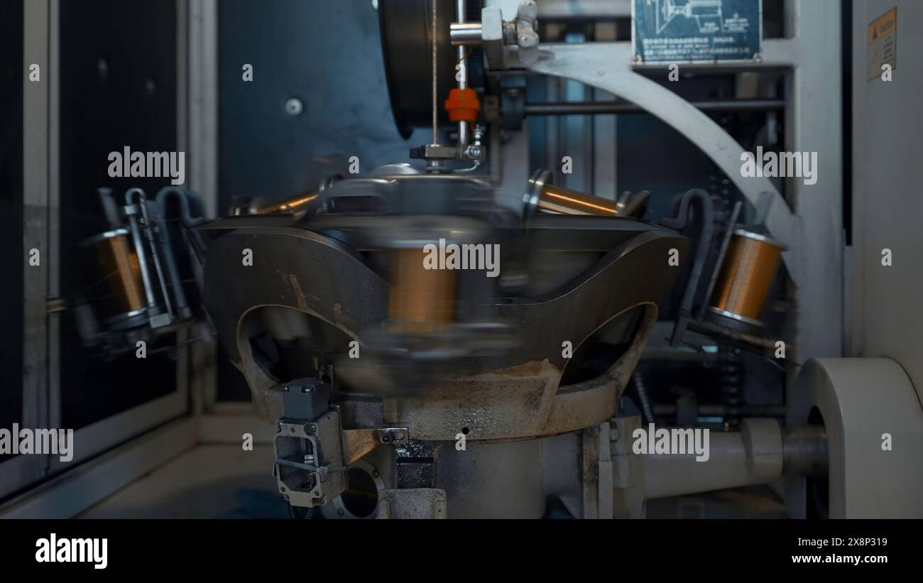 Rotating machine with copper wire winding. Creative. Automated machine ...