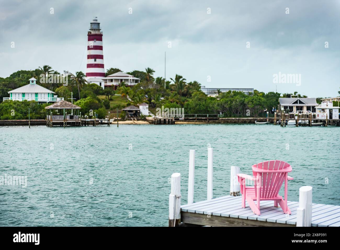 Pink Adirondack Chair on pier faces Elbow Reef Lighthouse Stock Photo ...