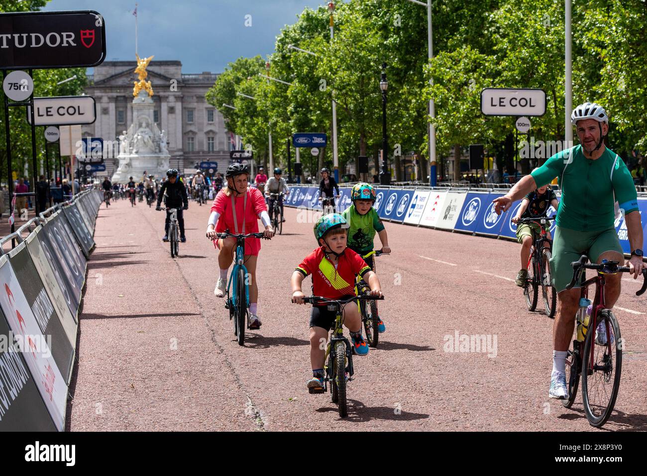 London, UK. 26th May, 2024. Cyclists ride through The Mall in London ...