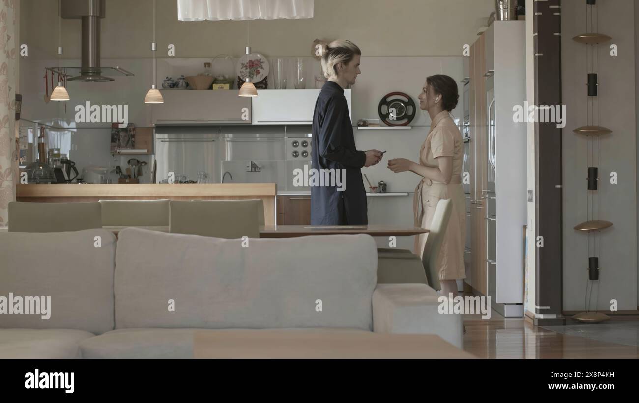 Young woman is talking to man who is walking away. Stock. Beautiful ...