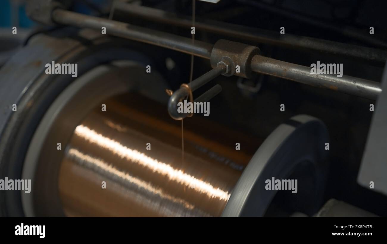Close-up of coil winding copper wire. Creative. Shiny copper wire is ...
