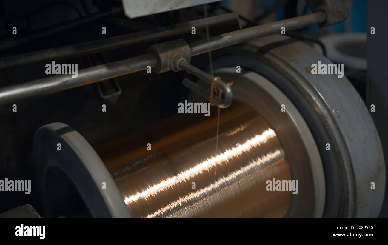 Close-up of coil winding copper wire. Creative. Shiny copper wire is ...