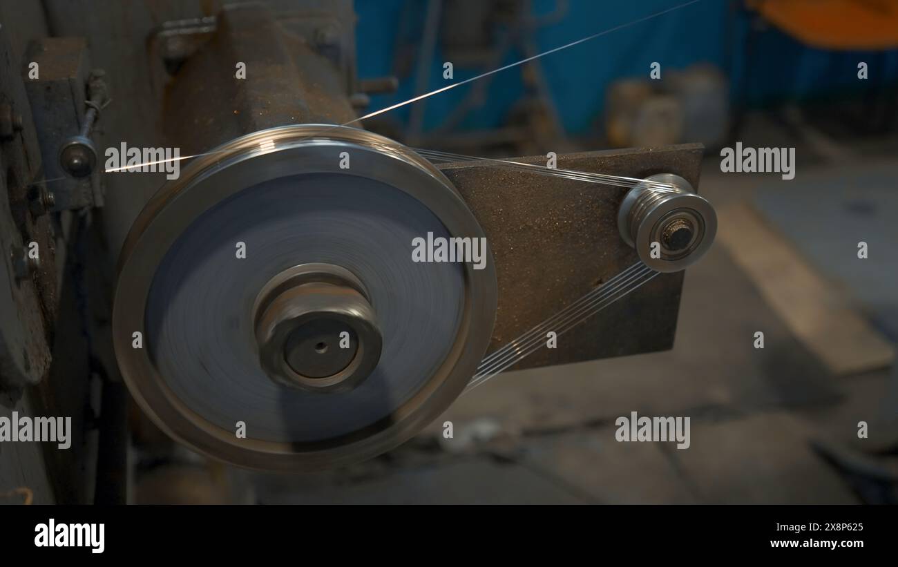 Industrial Rotating Machine with wire. Creative. Rotating coils winding ...