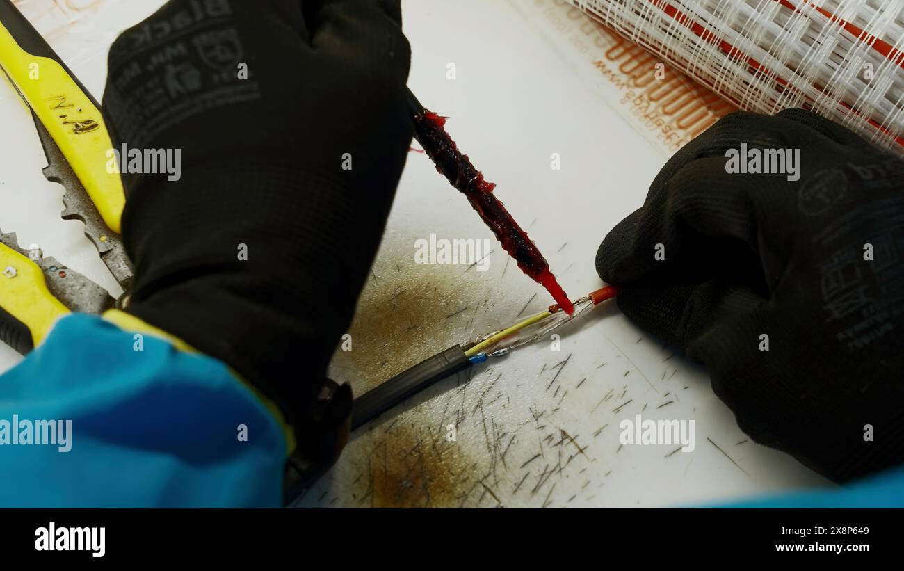 Close up of an electrical soldering wires with special equipment ...