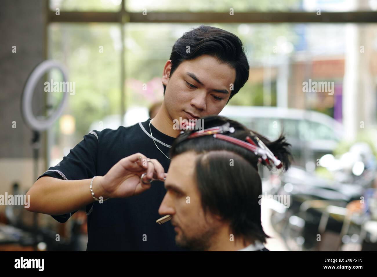 Man getting haircut hairdresser modern hi-res stock photography and ...