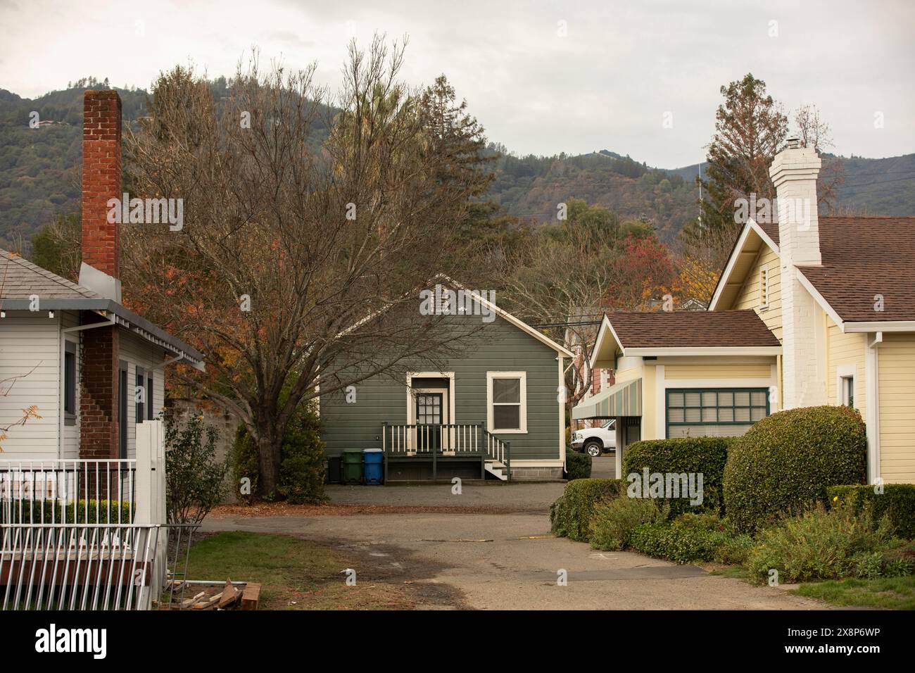 Aumtum cloudy light and foliage frame homes and buildings in downtown ...