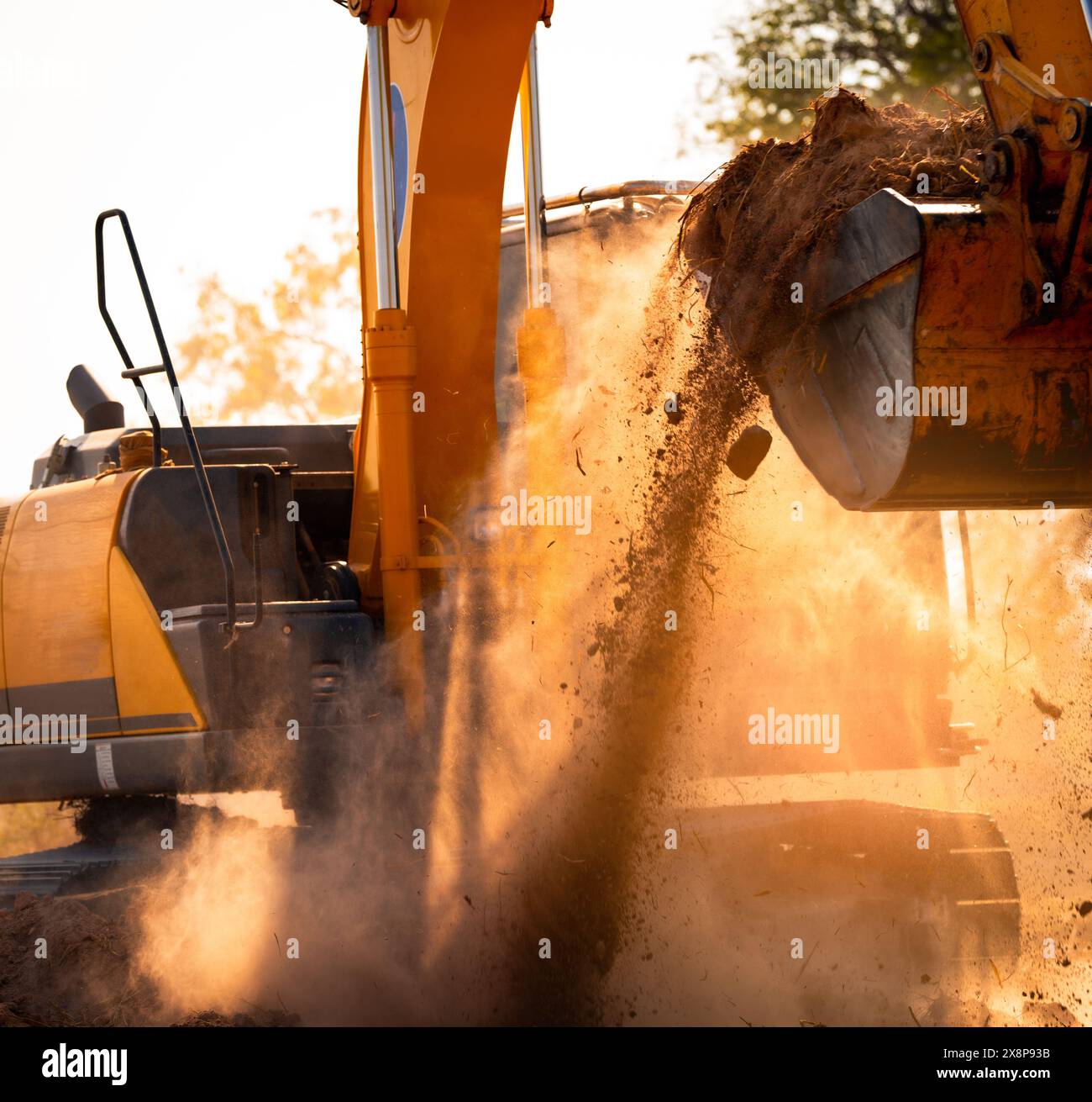 Close-up of excavator at construction site. Backhoe digging soil for ...