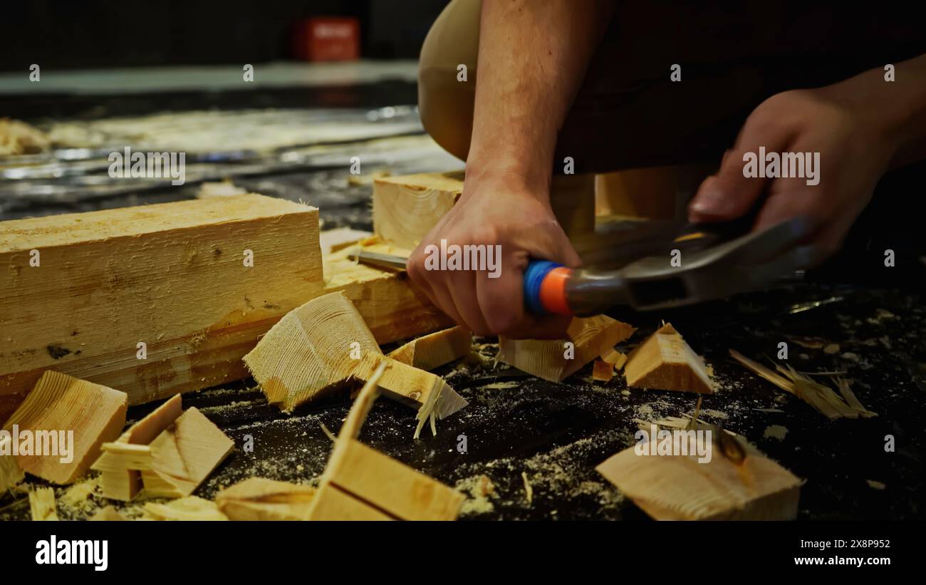 Carpentry works, carving wood block. Media. Using chisel for processing ...