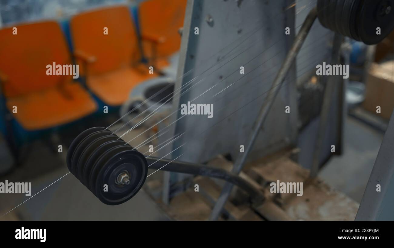 Metal threads rotate on industrial machine. Creative. Rotating shafts ...