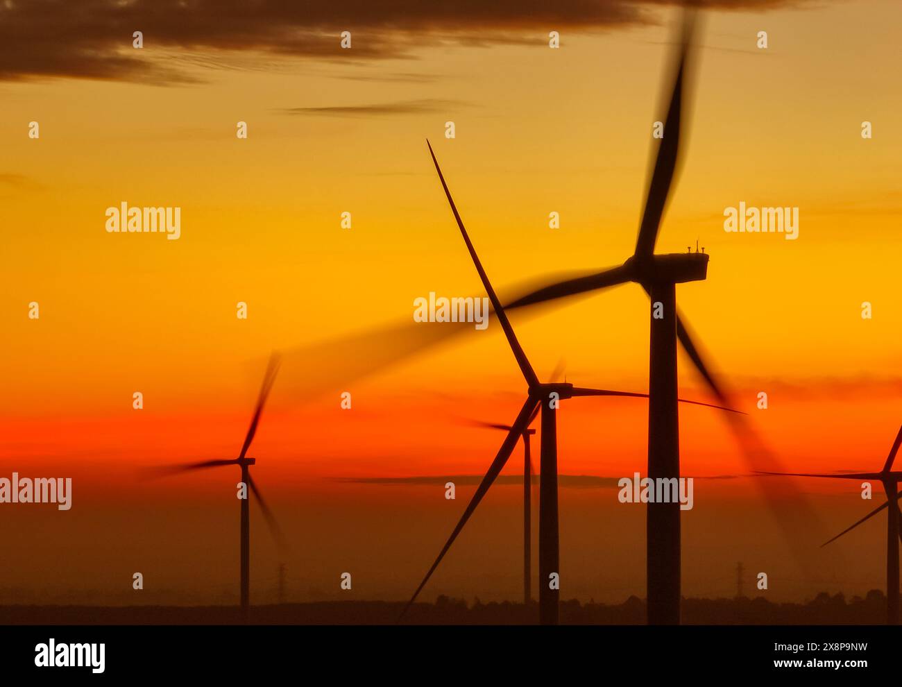 Wind farm landscape against sunset sky. Wind energy. Wind power ...