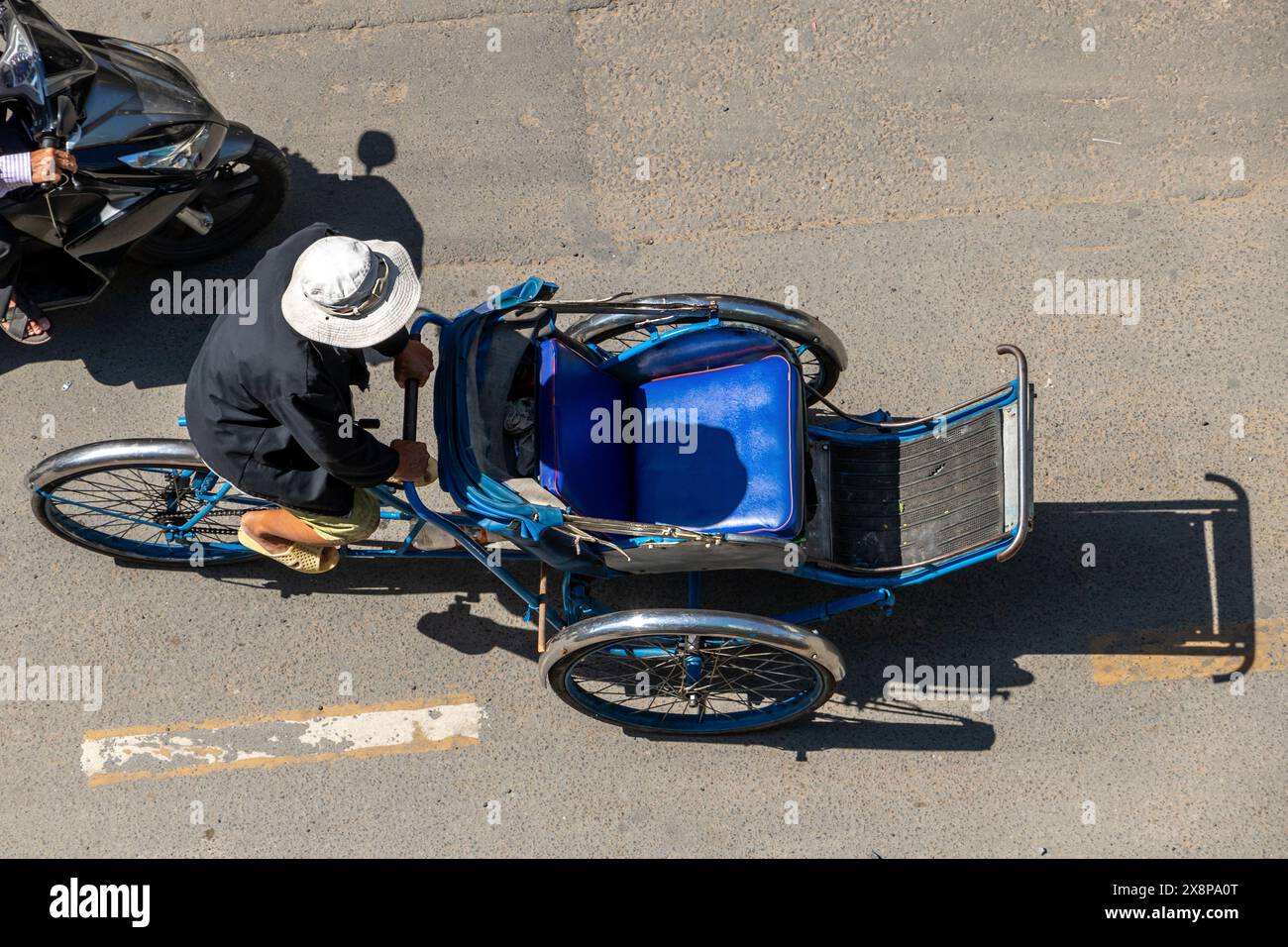 A man drives a tricycle for transport a passenger, Saigon, Vietnam ...