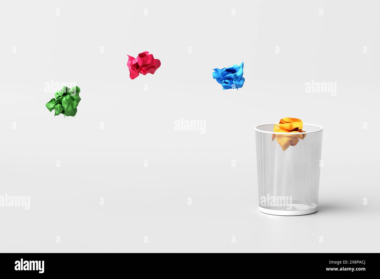 Colorful crumpled papers thrown into the office trash bin on white ...
