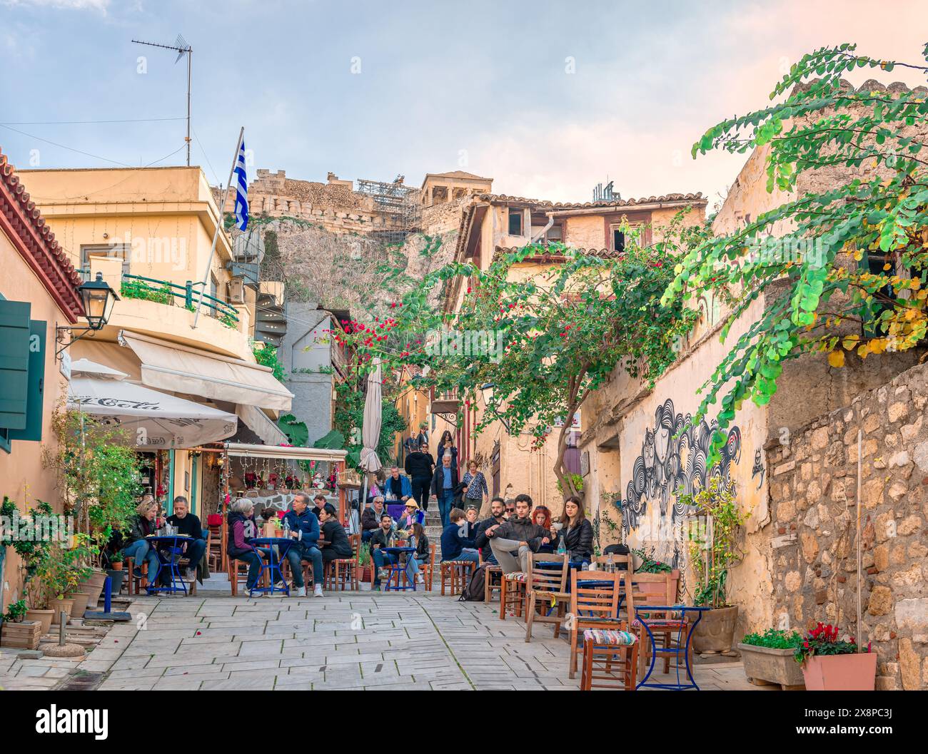 Sidewalk café in Plaka, the old historical neighborhood clustered ...