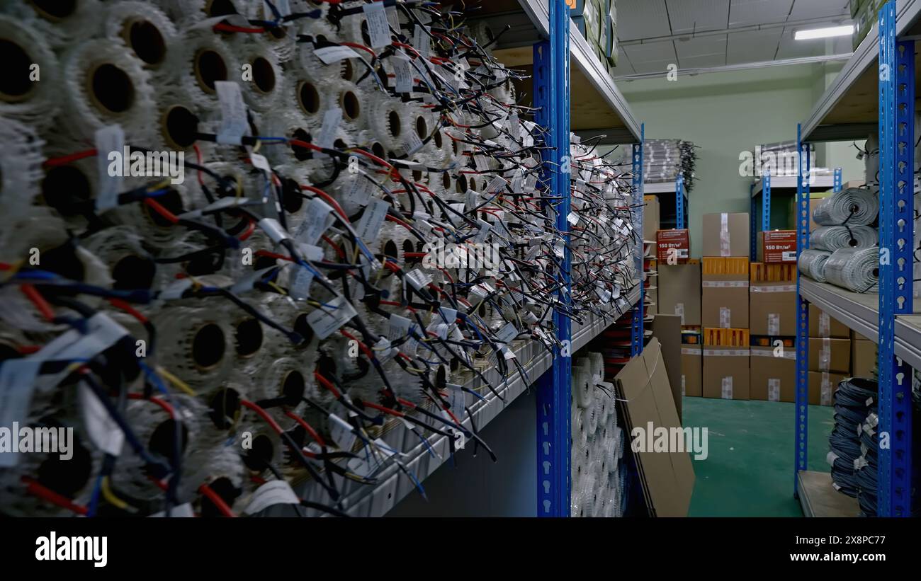 A large warehouse of products in rolls. Creative. Moving along shelves ...