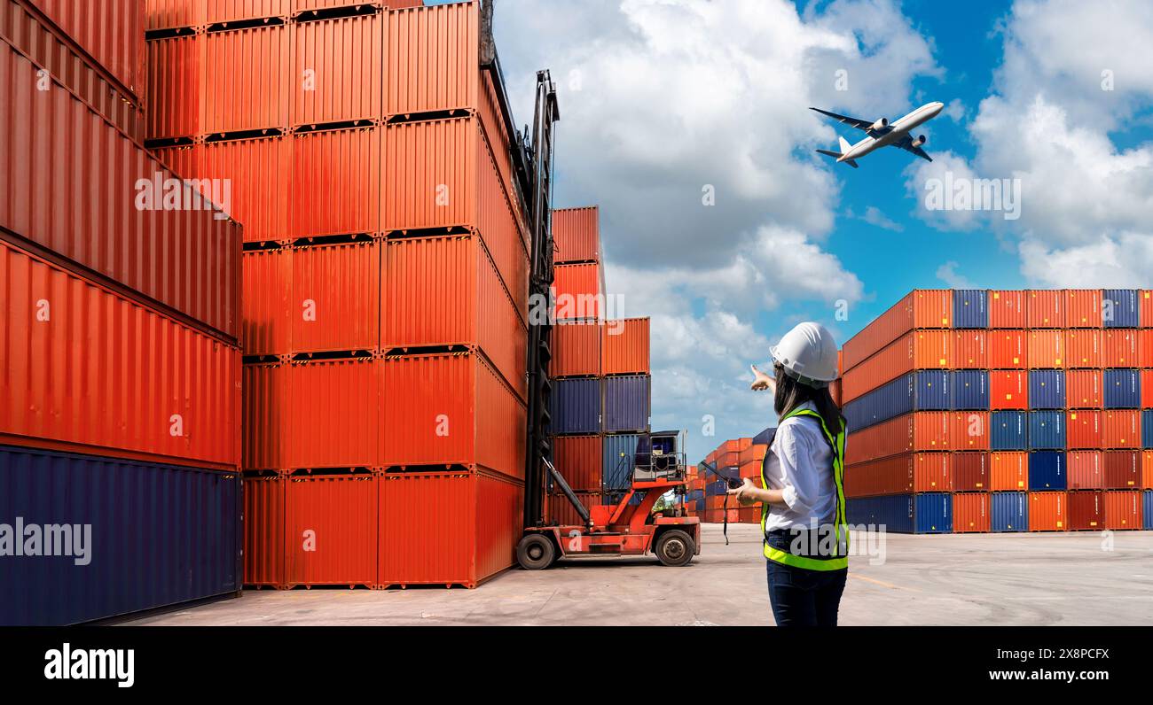 Foreman Woman control loading Containers box from Cargo freight ship ...