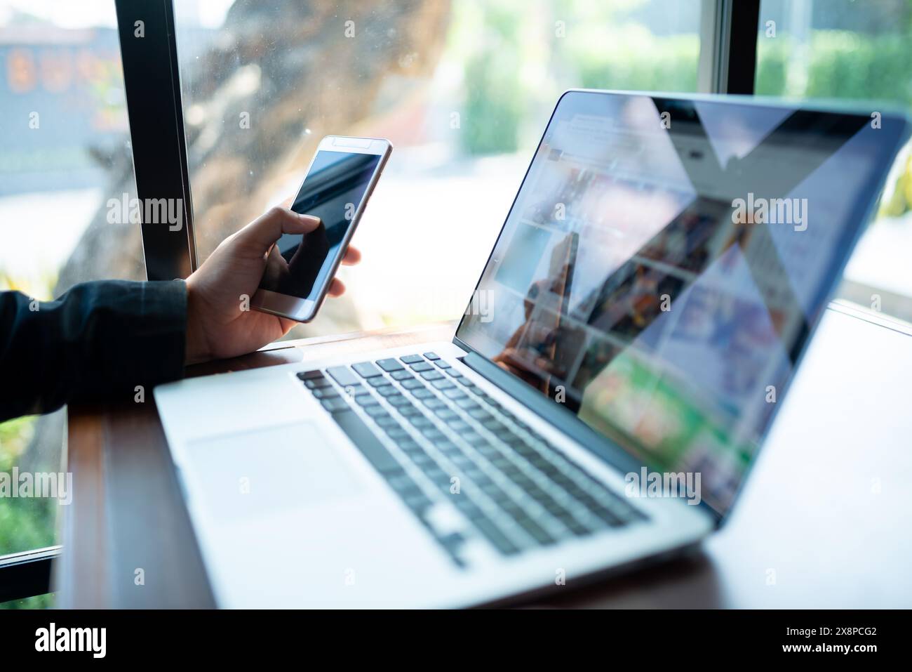 Businessman uses smartphone to share internet connection to work on ...