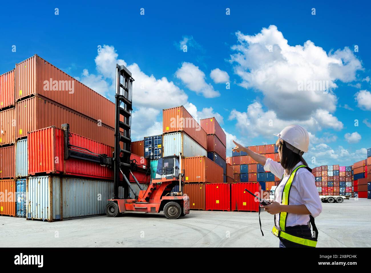 Foreman Woman control loading Containers box from Cargo freight ship ...