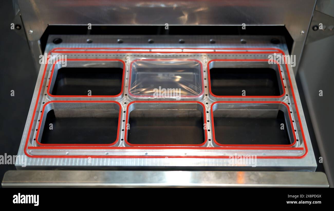 Production of plastic packages, industrial background. Media. Close up ...