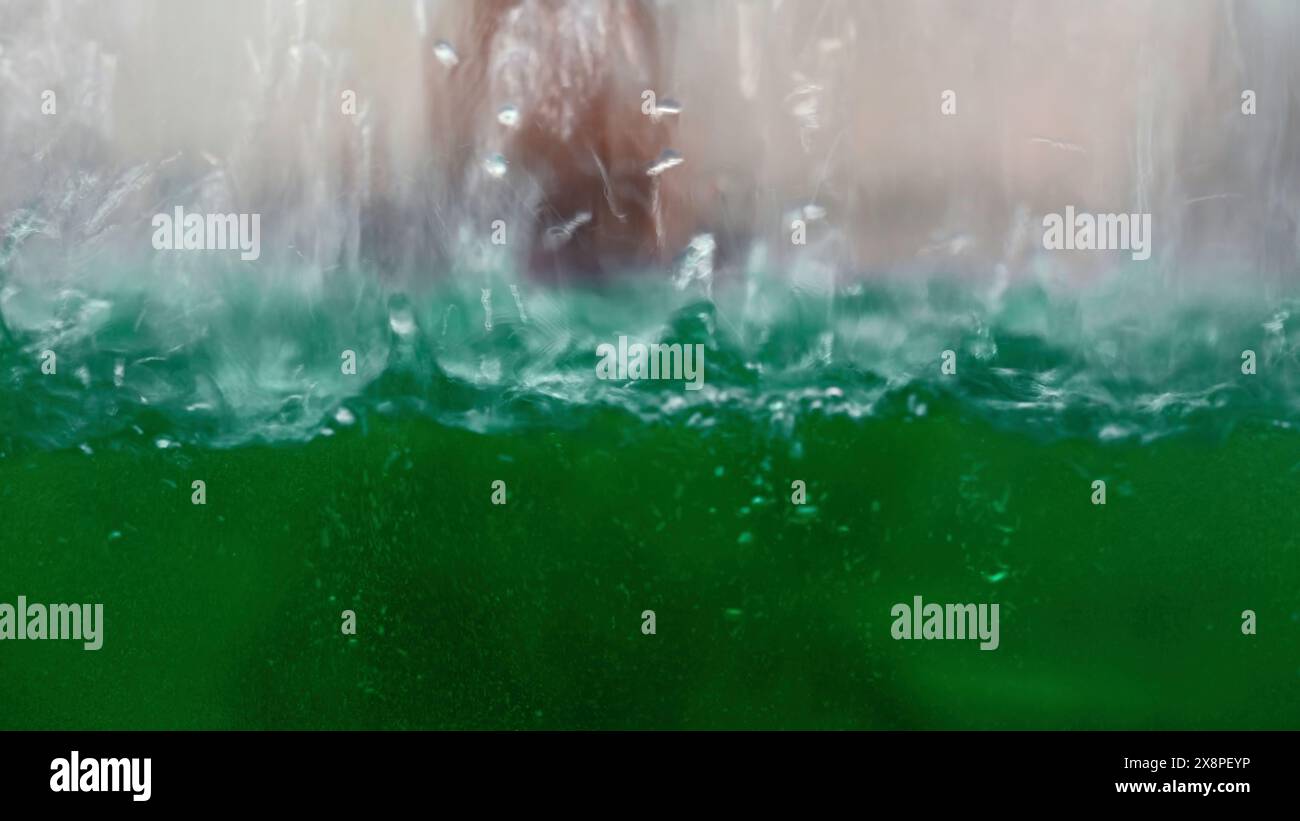 industrial background with a transparent reservoir being filled with ...