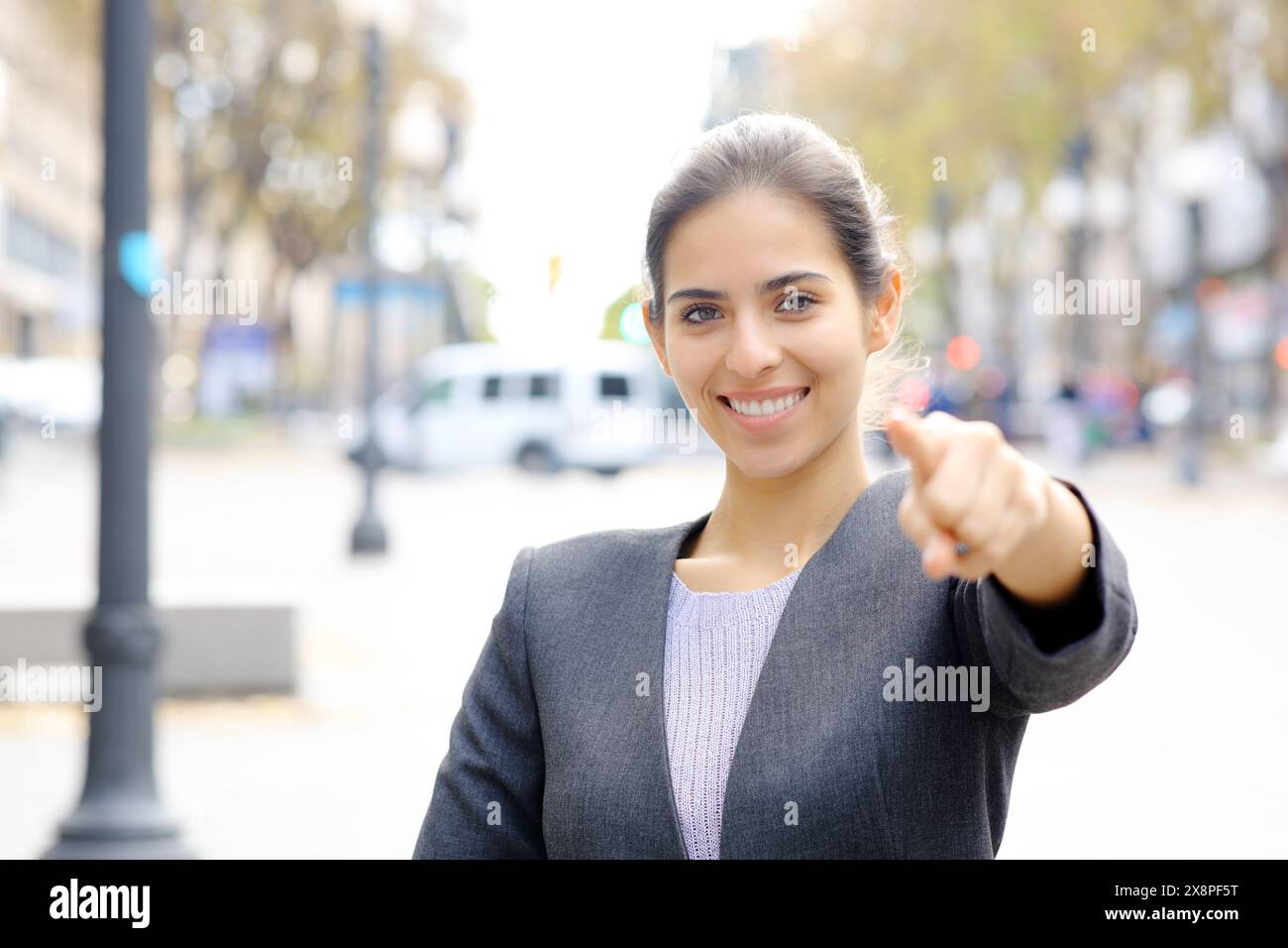 Female employee standing pointing hand hi-res stock photography and ...