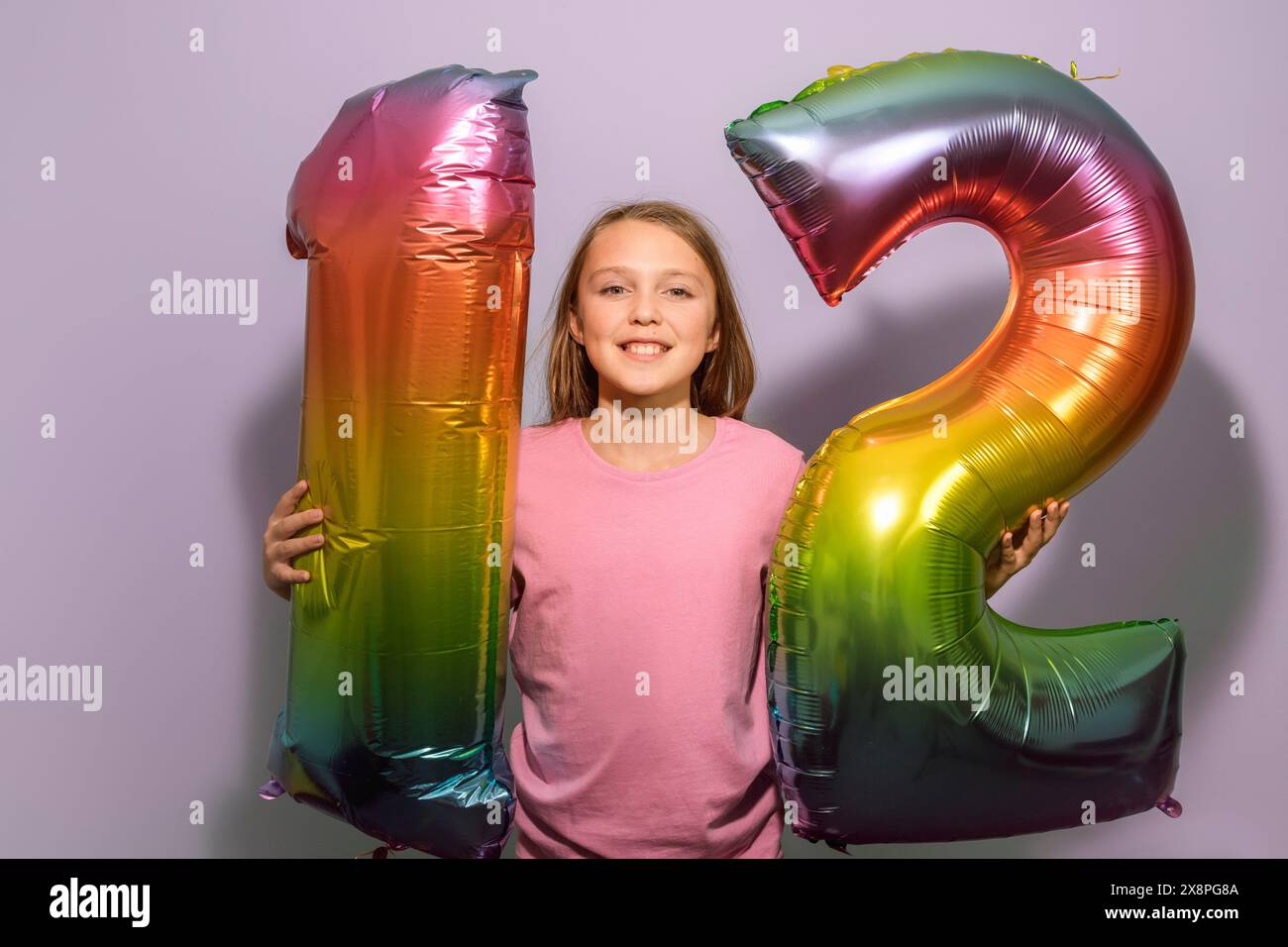Teenage girl with large inflatable numbers 12. Teenager's twelfth ...