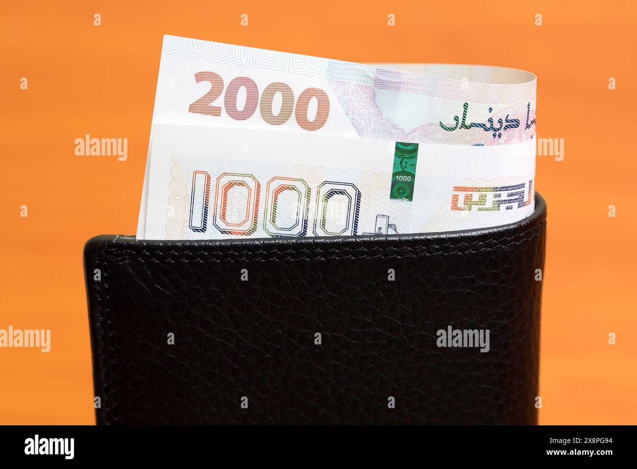 Algerian money - dinar in the black wallet Stock Photo - Alamy