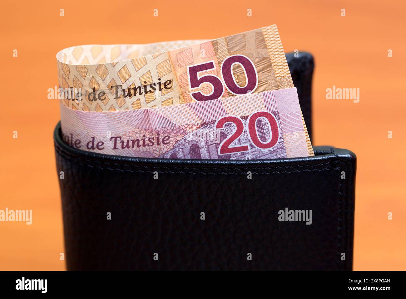 Tunisian money - dinar in the black wallet Stock Photo - Alamy