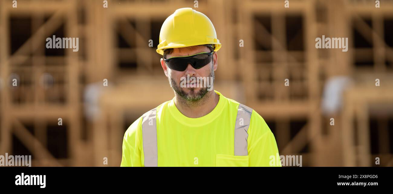 Construction builder in building uniform on buildings construction ...