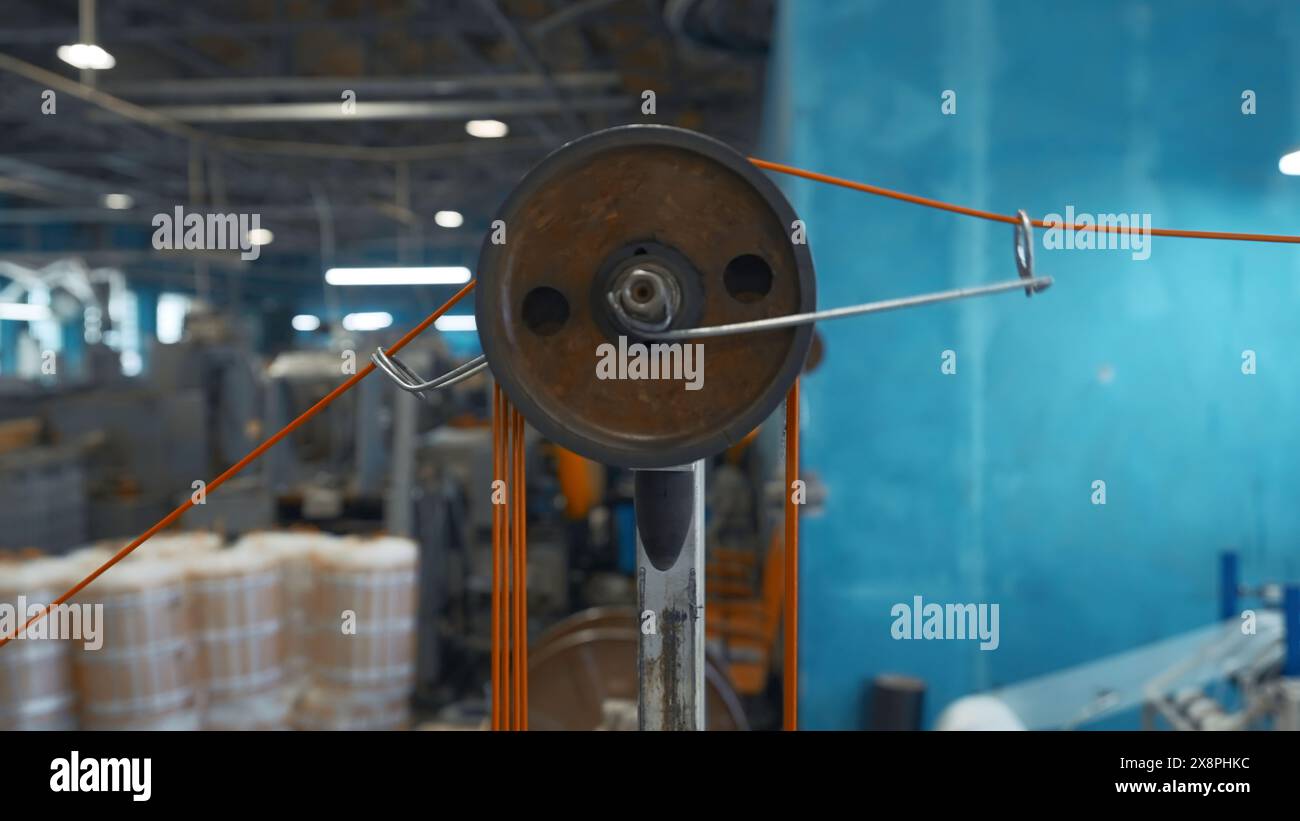 Industrial machine with rotating coils and wire. Creative. System with ...