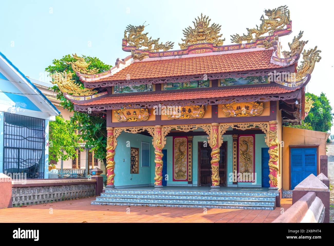 The communal house with elaborate carved columns of pottery is a ...